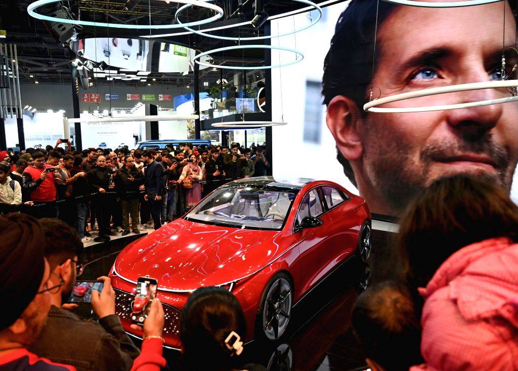 Visitors explore the Mercedes exhibit during the Bharat Mobility Global ...