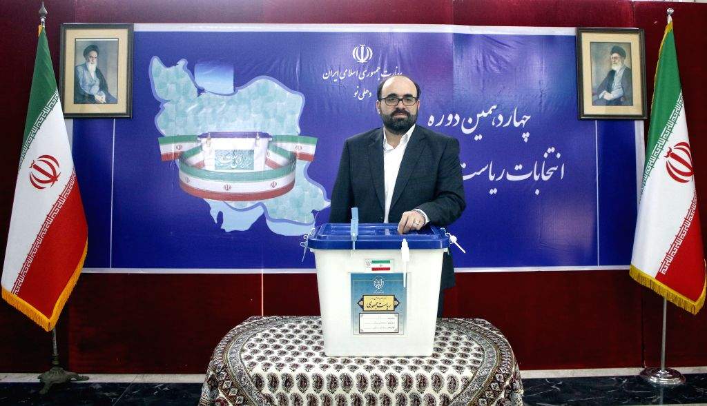 Votes are being cast for the presidential election of Iran at a polling ...