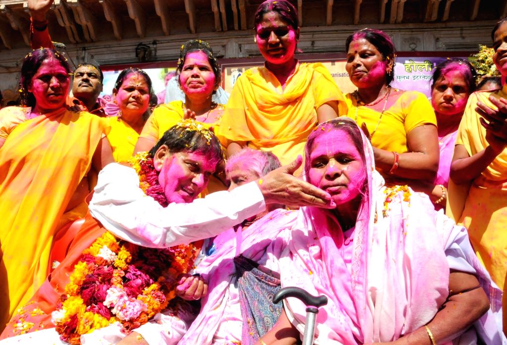 Vrindavan : Widows play with colours during the Holi celebrations