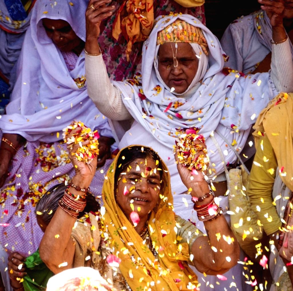 Vrindavan : Widows play with colours during the Holi celebrations