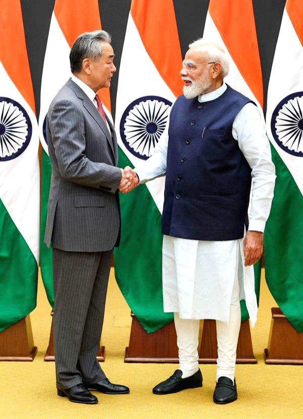 Wang Yi meets PM Modi