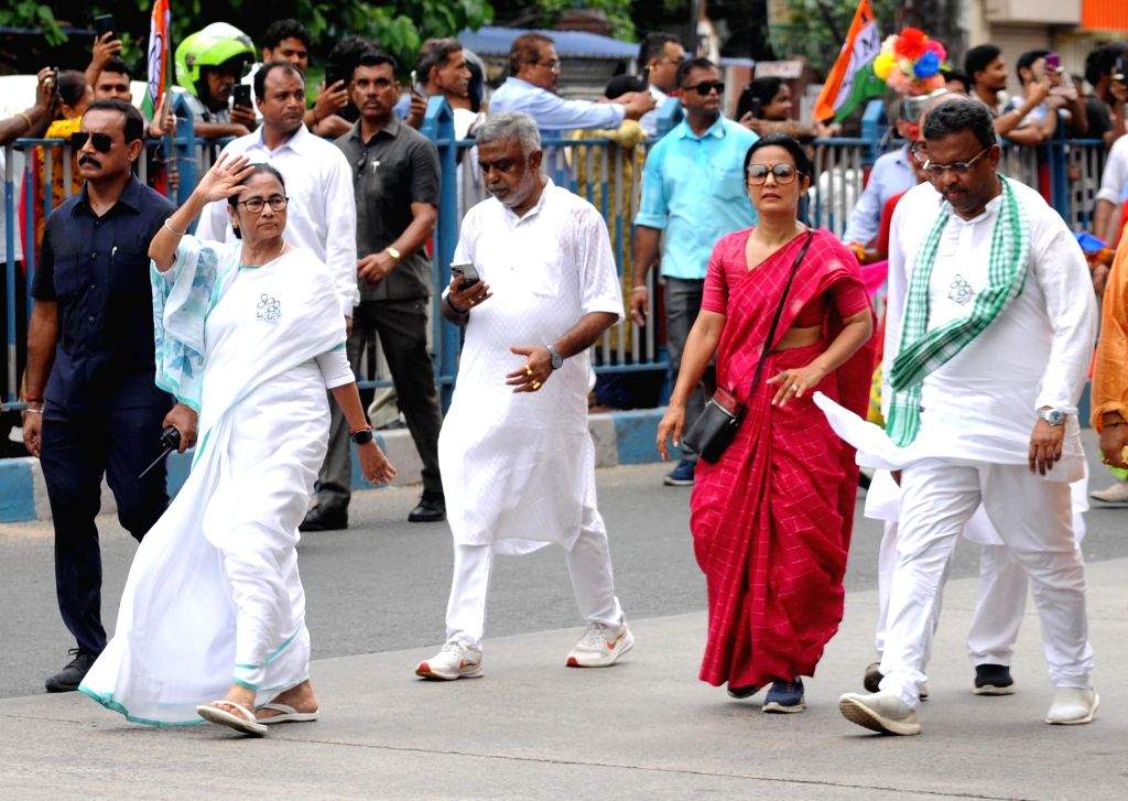 West Bengal Chief Minister Mamata Banerjee, along with party candidates ...
