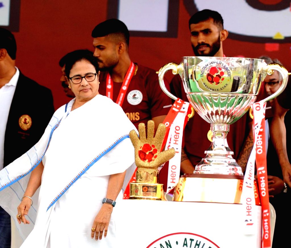 West Bengal Chief Minister Mamata Banerjee takes a look at ISL trophy