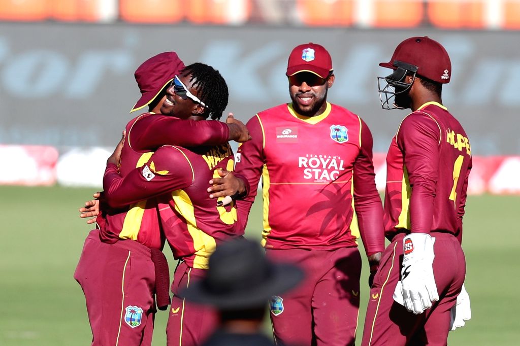 :Ahmedabad:West Indies bowler Hayden Walsh, left, celebrates the wicket ...