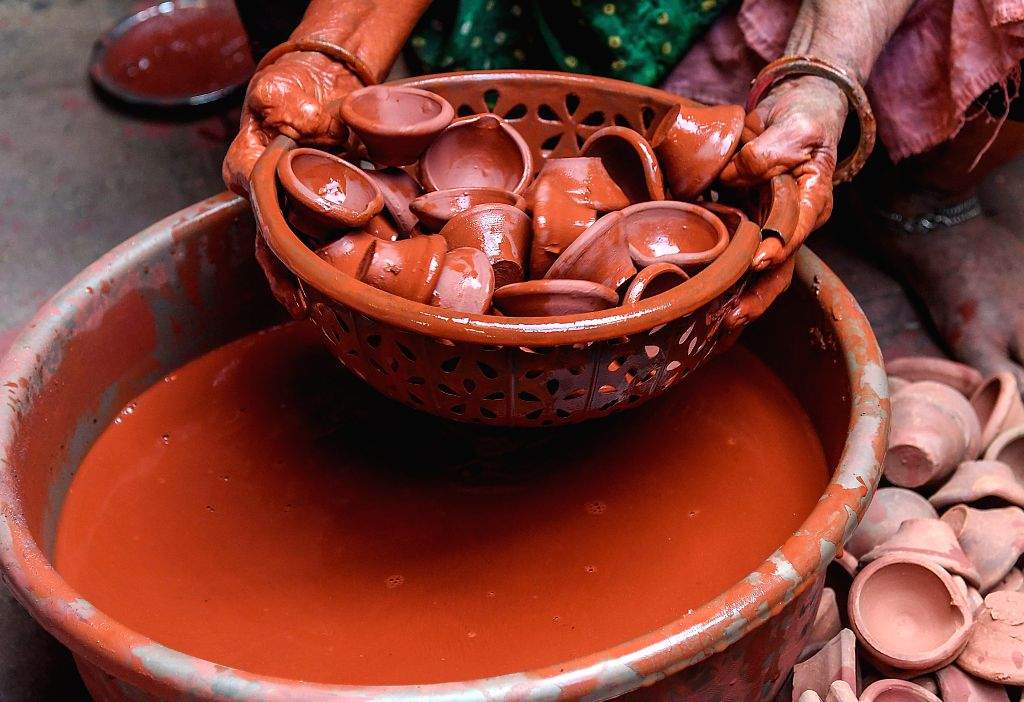 Woman Makes Diya Ahead of Diwali