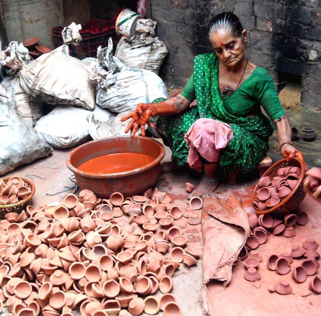 Woman Makes Diya Ahead of Diwali
