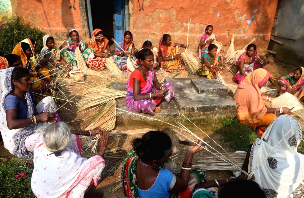 Women make bamboo baskets in Purulia