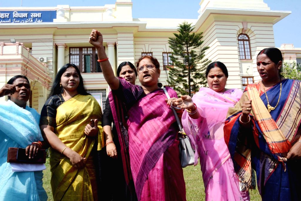 Women MLAs stage a protest on the occasion of International Women's Day