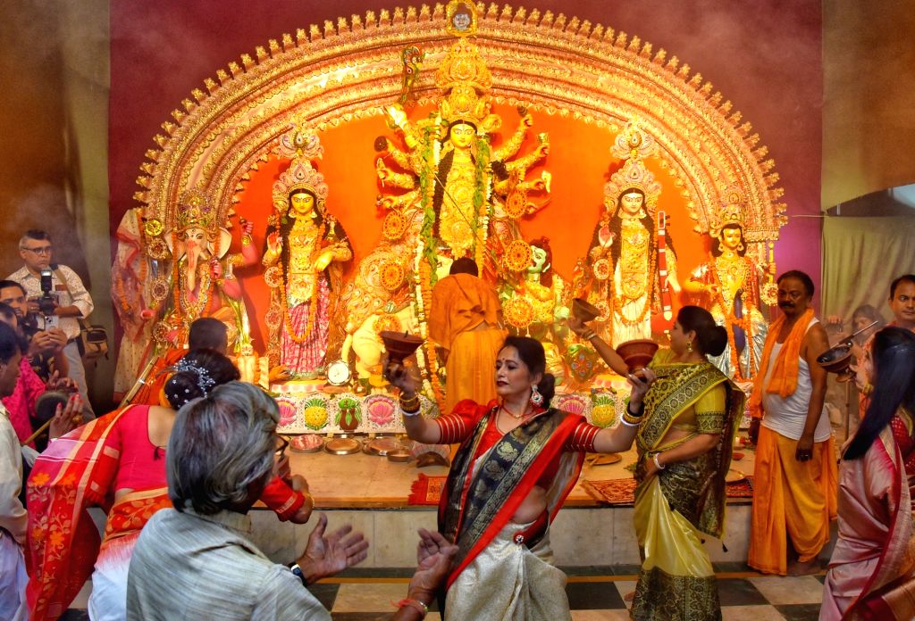 Women perform Dhunuchi dance to the beats of drum rolls during the ...