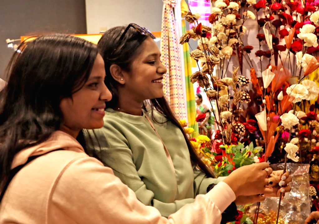 Women visit a stall at the 41st India International Trade Fair