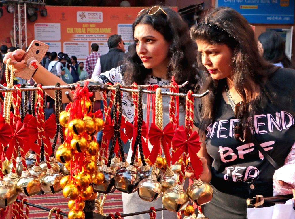 Women visit a stall at the 41st India International Trade Fair