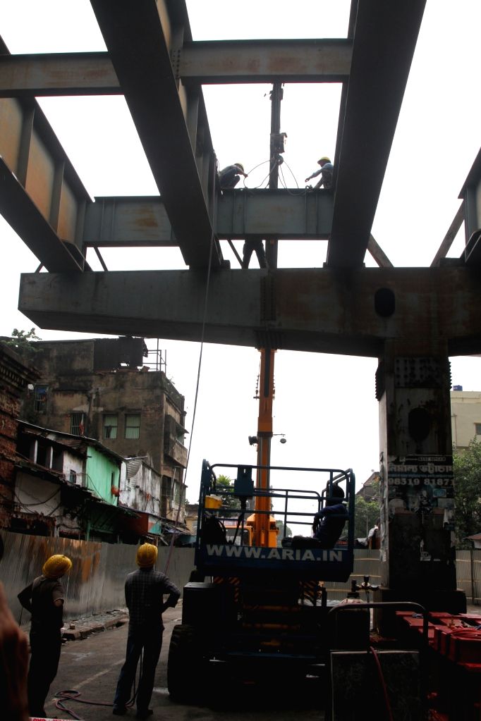 Workers were busy demolishing the incomplete Vivekananda flyover which ...
