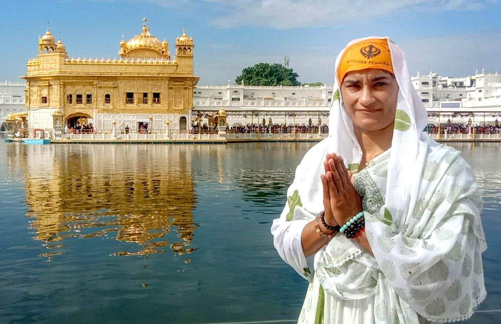 Wrestler Vinesh Phogat with family visits and offer prayer at Golden Temple