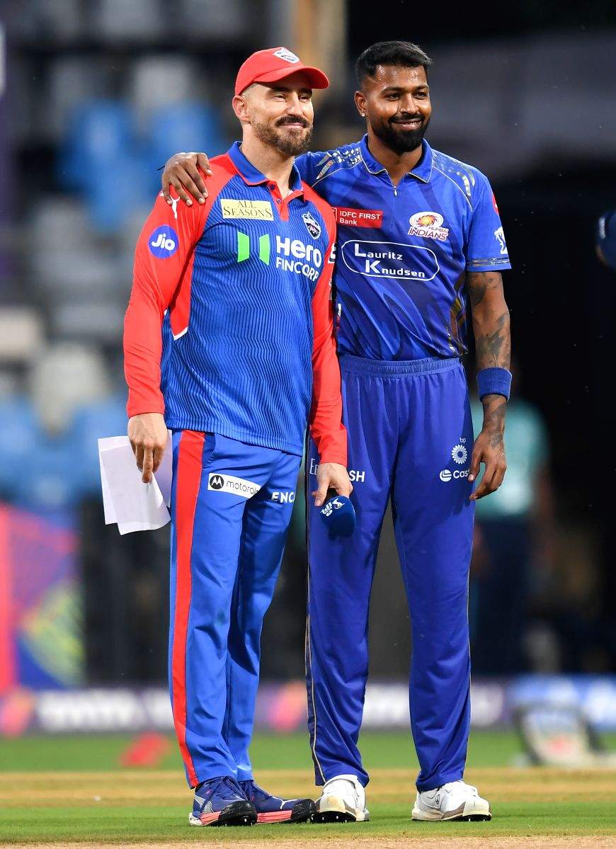 Mumbai Indians Clinch Playoff Spot with Big Win Over DC