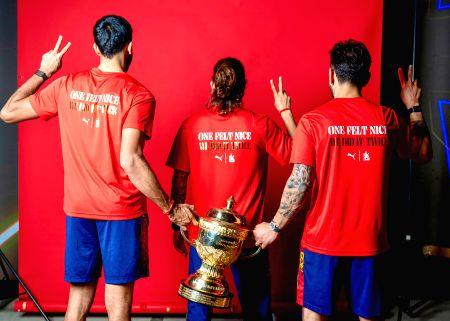 RCB players celebrate with IPL 2026 trophy