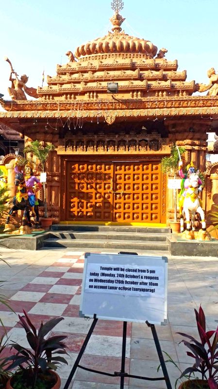 A temple is closed due to partial solar eclipse