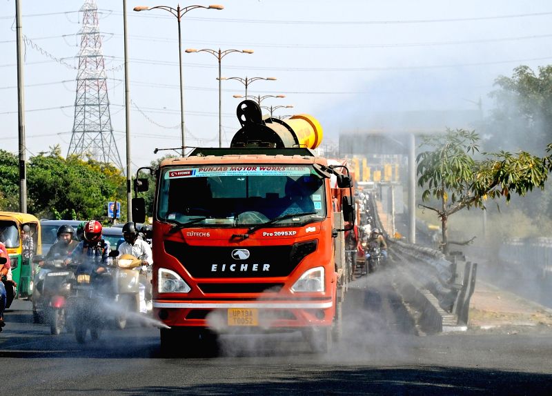 An anti-smog gun sprinkle water to curb air pollution