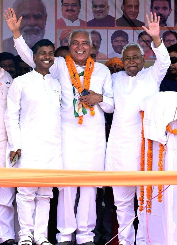 Bihar Chief Minister Nitish Kumar with party candidate Devesh Chandra ...