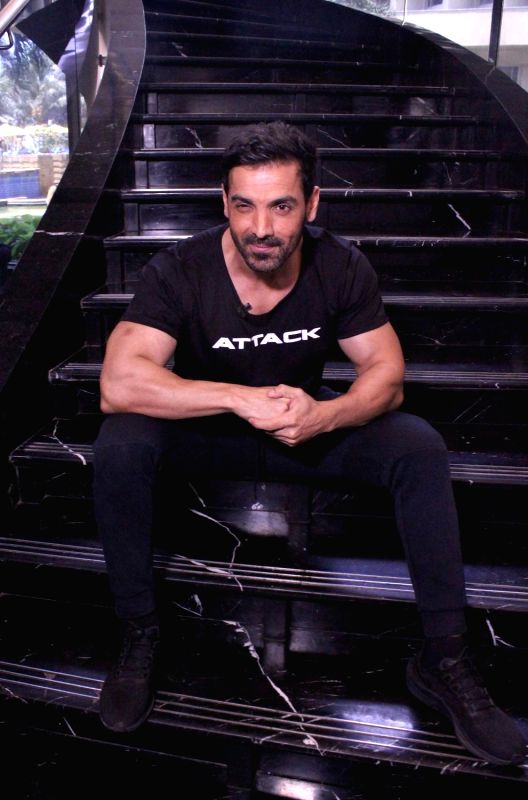 : Mumbai:Bollywood Actor John Abraham poses for photos.