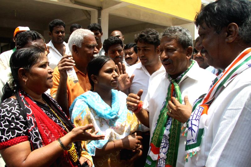 Congress Candidate Byrathi Basavaraju campaigning