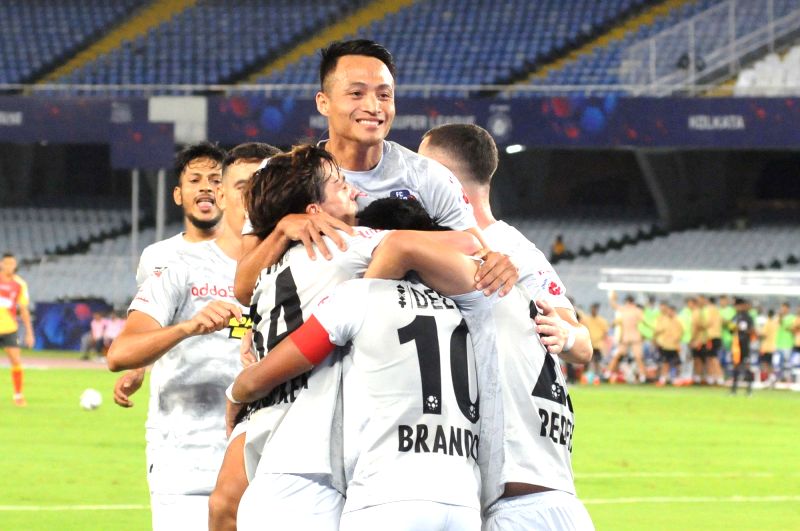 FC Goa player Brandon Fernandes (C) with others celebrate after scoring ...