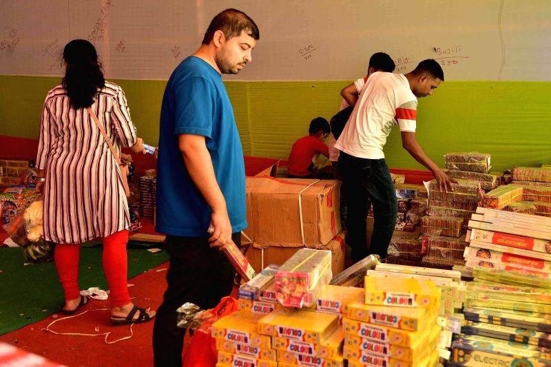 Guwahati : People buy firecrackers on the occasion of Diwali festival