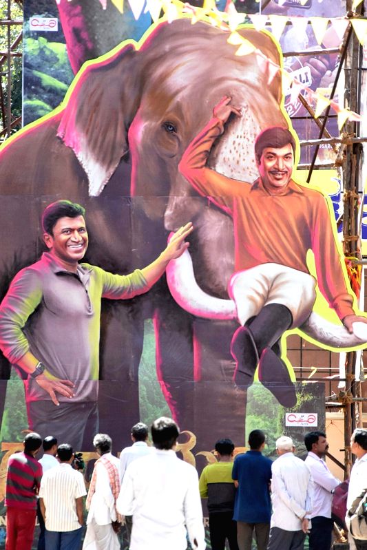 Huge cut-outs of Rajkumar and his son Puneeth Rajkumar from the movie ...
