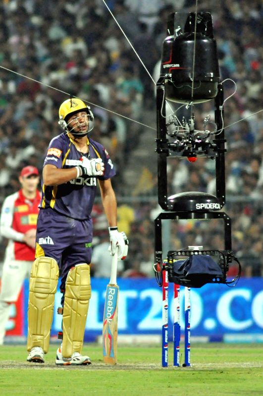 KKR players celebrate fall of wicket during the match between Kolkata ...
