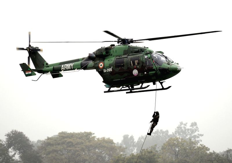 New Delhi:Army Commandos slithering out of a helicopter to show their ...