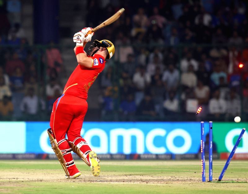 : New Delhi : PBKS' batsman Liam Livingstone is bowled during the IPL ...