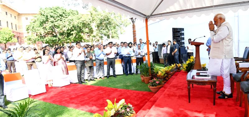 Modi meets officials and staff of PMO