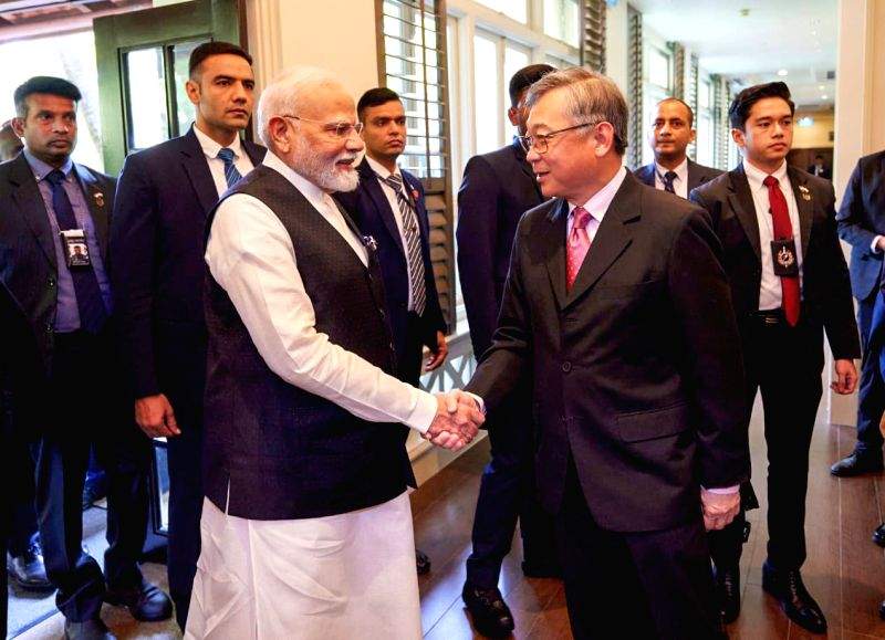 Prime Minister Narendra Modi with Deputy Prime Minister Gan Kim Yong ...