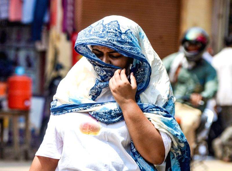 Residents Shield Themselves From Heatwave